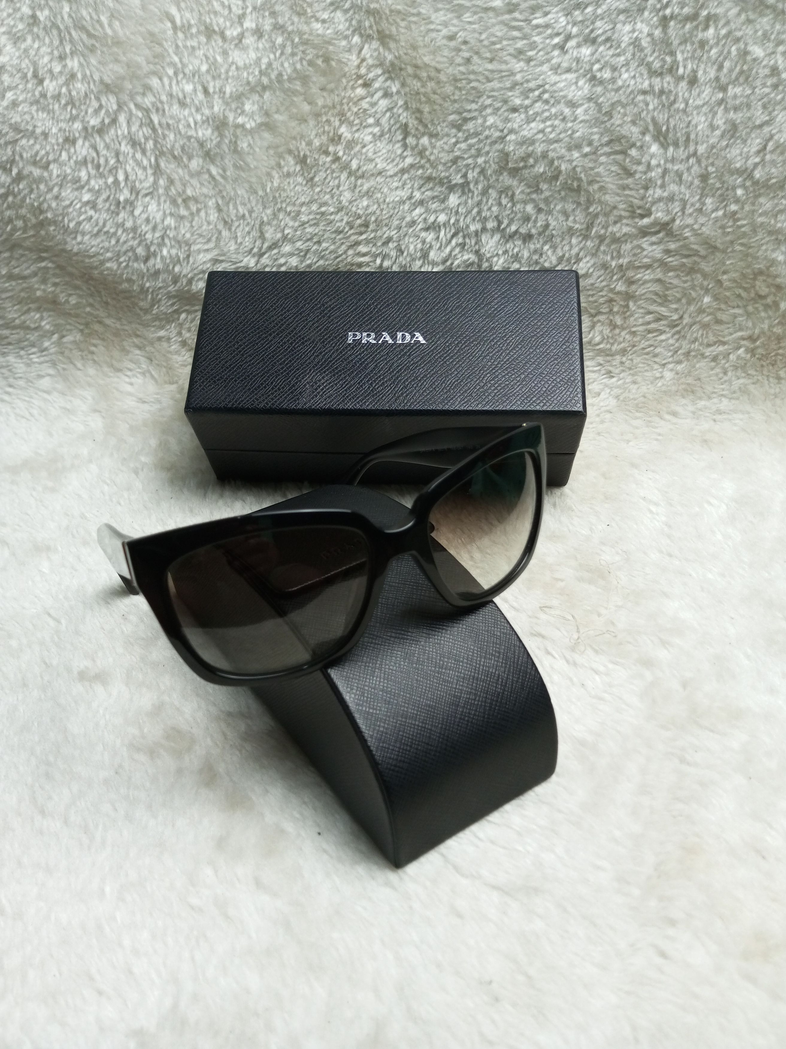 Prada Prada sunglasses SPR07P-A black | Grailed