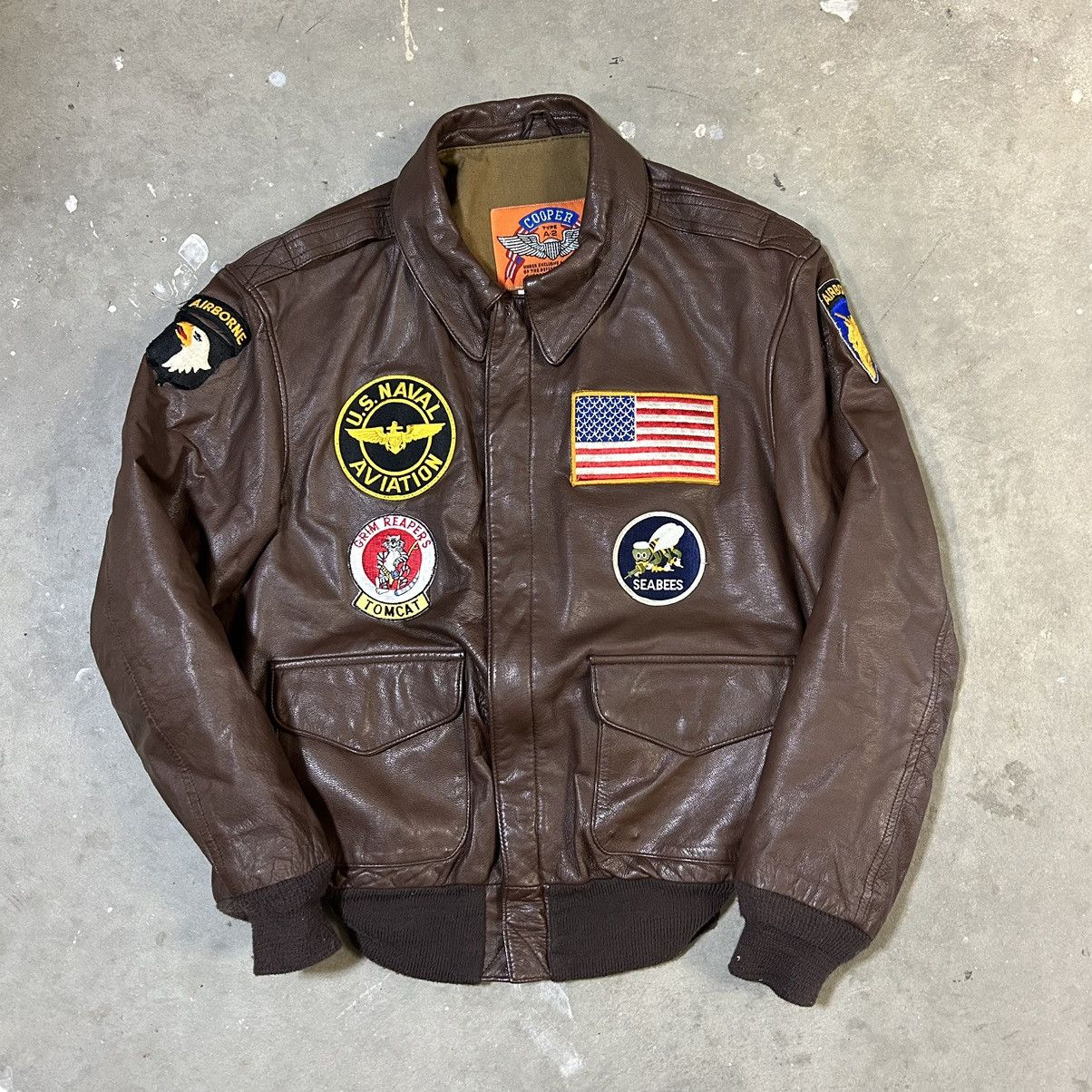 Vintage Vintage Cooper, A2 brown leather jacket w military patches ...