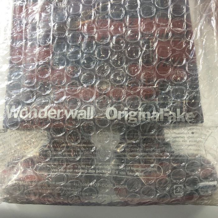 Kaws kaws Wonderwall Vinyl Figure Red | Grailed