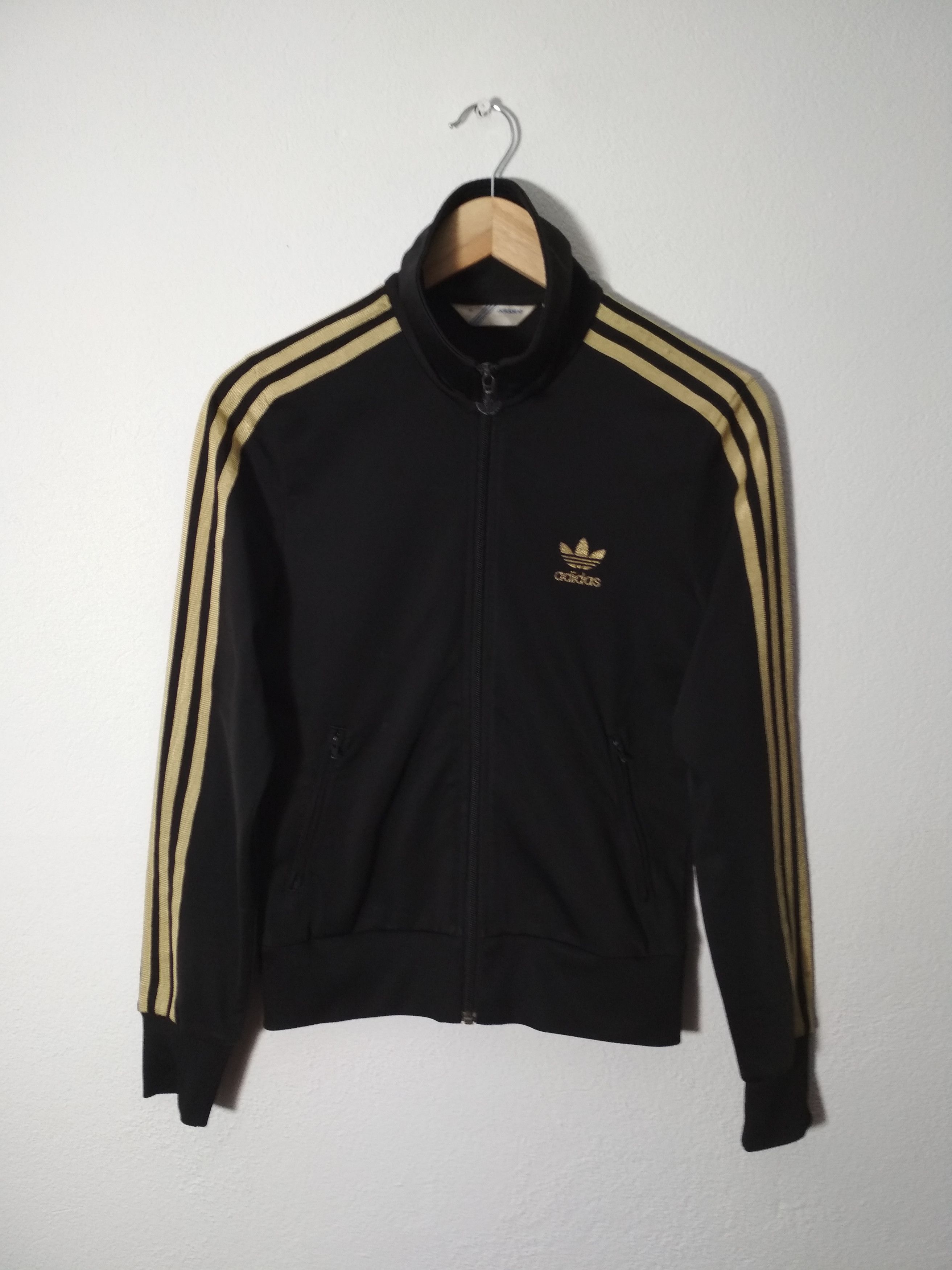 Adidas Black Adidas zip-up sweatshirt large gold logo on The back | Grailed