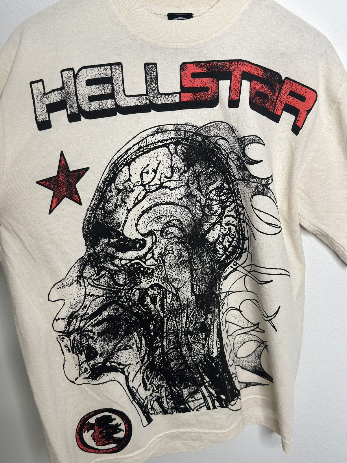 HELLSTAR Hellstar Studios Human Development Tee Cream | Grailed
