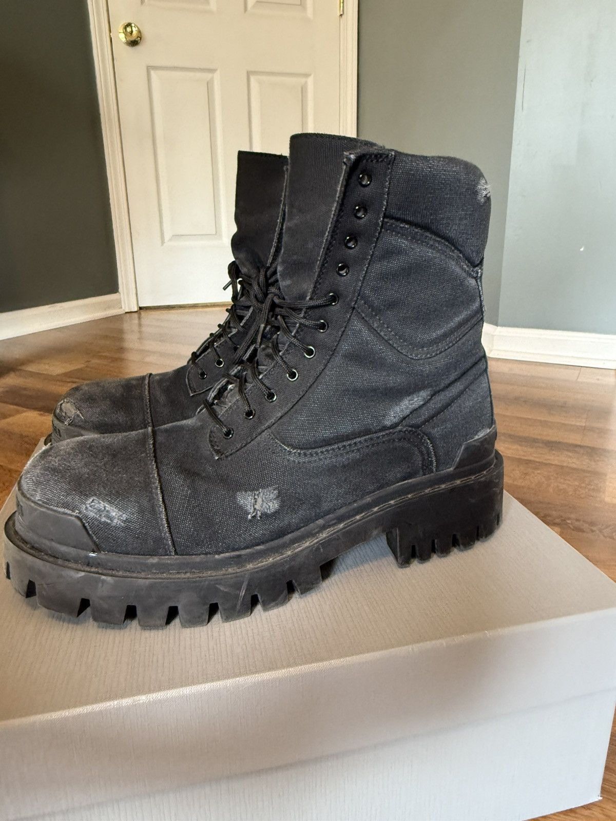 Balenciaga Balenciaga distressed combat strike boots | Grailed