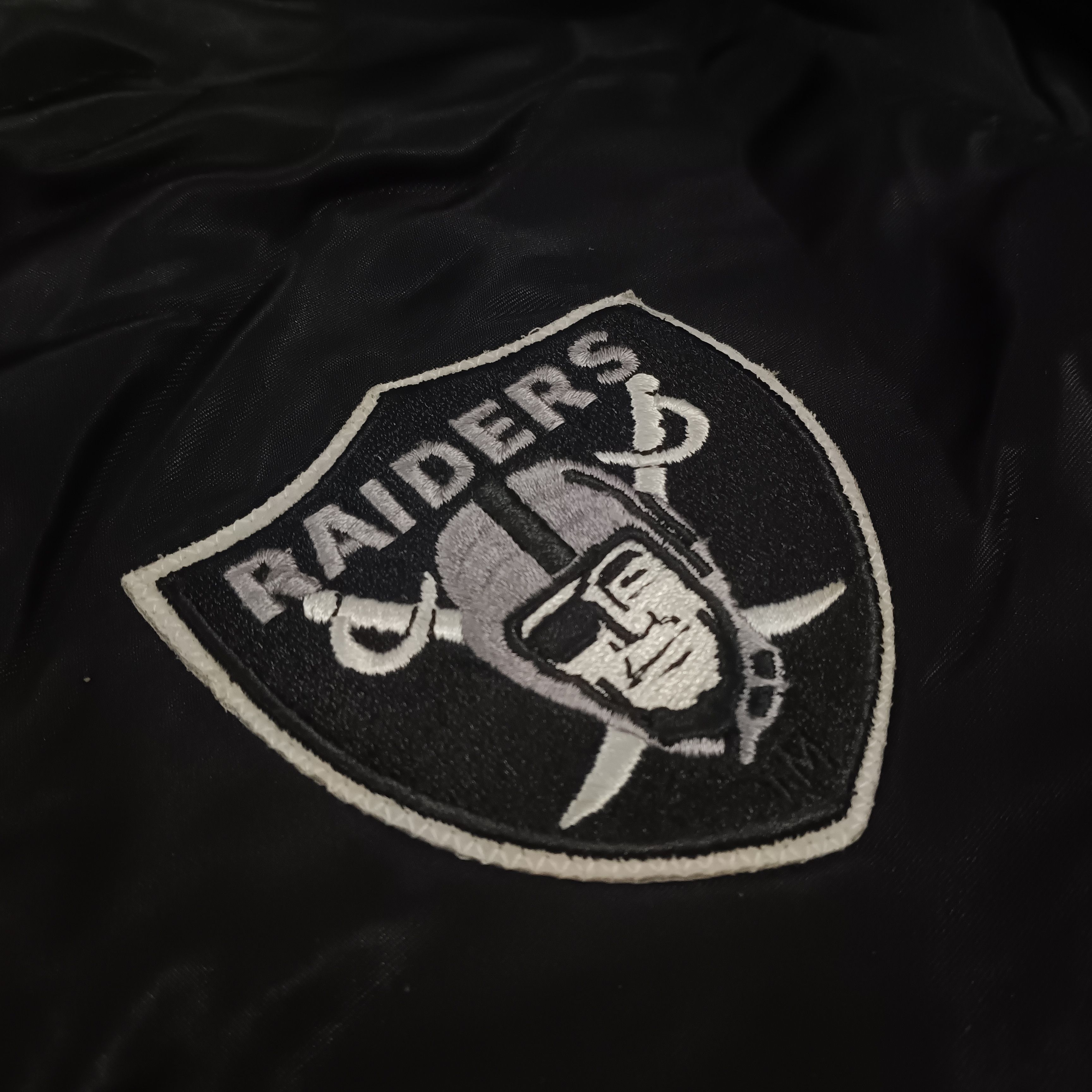 Starter Raiders varsity black | Grailed