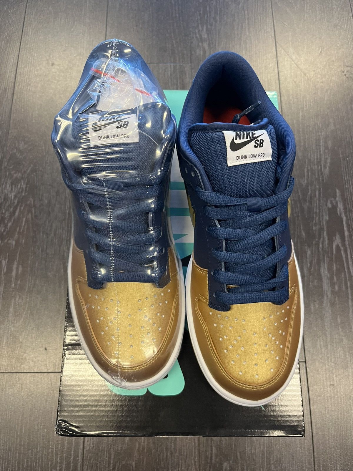Nike × Supreme Nike SB Dunk Low Supreme Jewel Swoosh Gold | Grailed