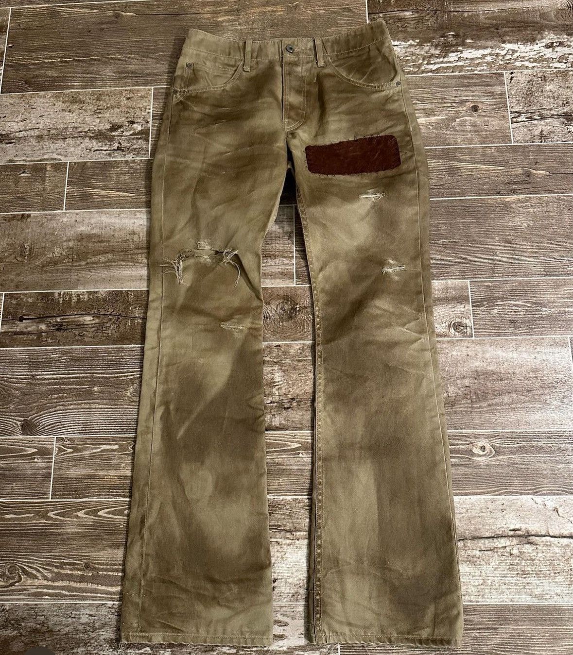 Isamu Katayama Backlash Isamu Katayama Backlash flared denim with leather patches | Grailed