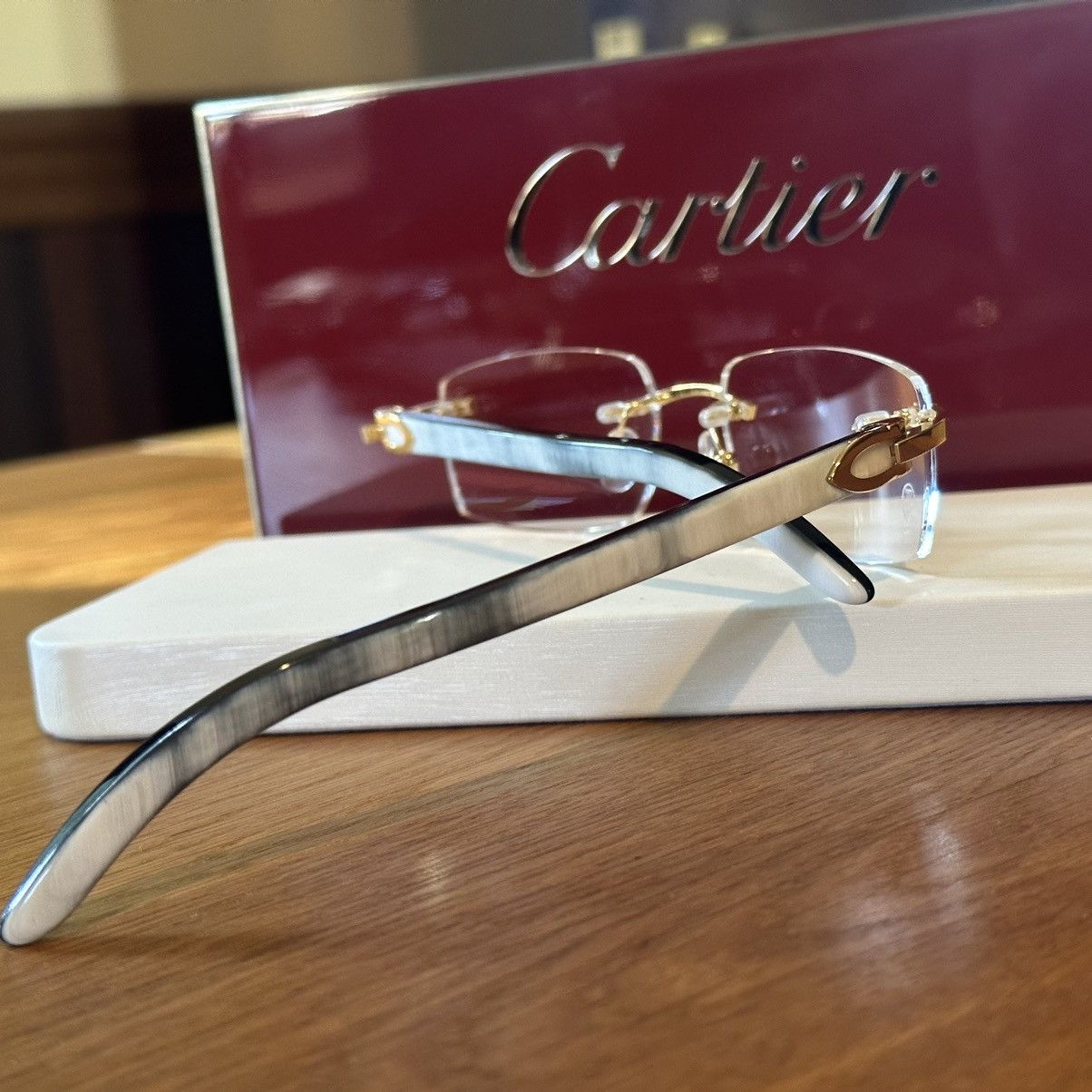 Cartier CT0046O-001 White Buffalo Horn Rimless Glasses | Grailed
