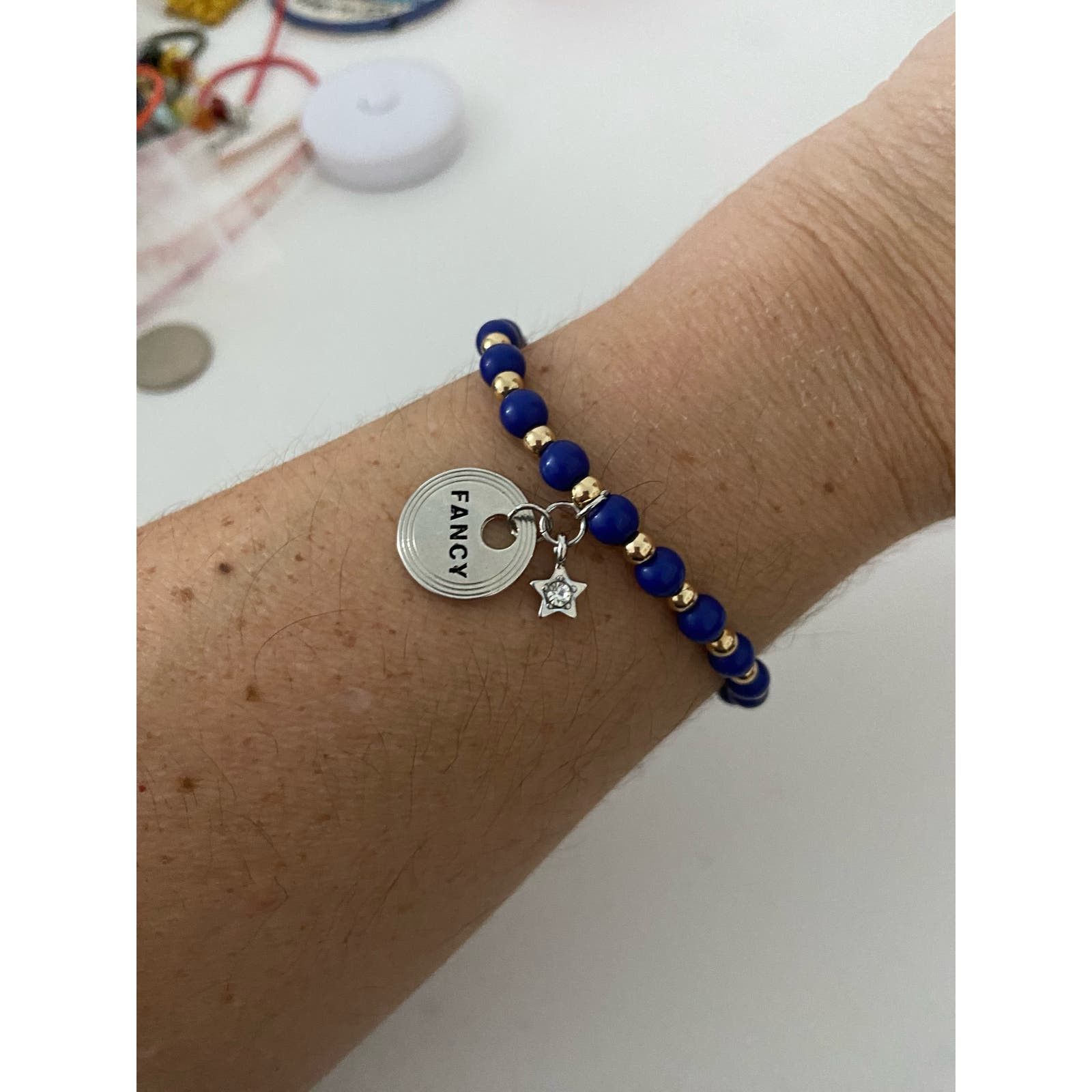 Generic blue and gold bead bracelet with fancy Star charms | Grailed