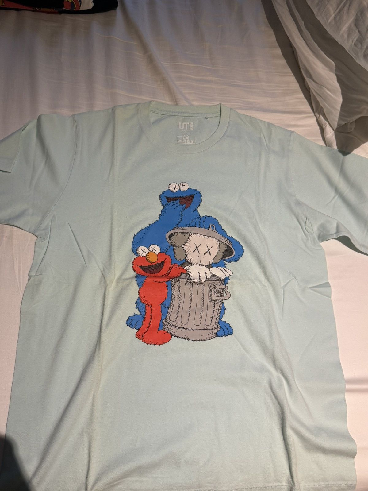 Kaws × Uniqlo Kaws x Sesame Street Companion Trash Can Tee | Grailed