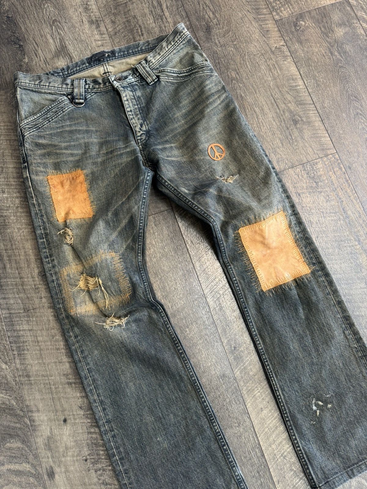 roarguns STUDDED GUNS DENIM PEACE PATCH FLARE JEANS | Grailed