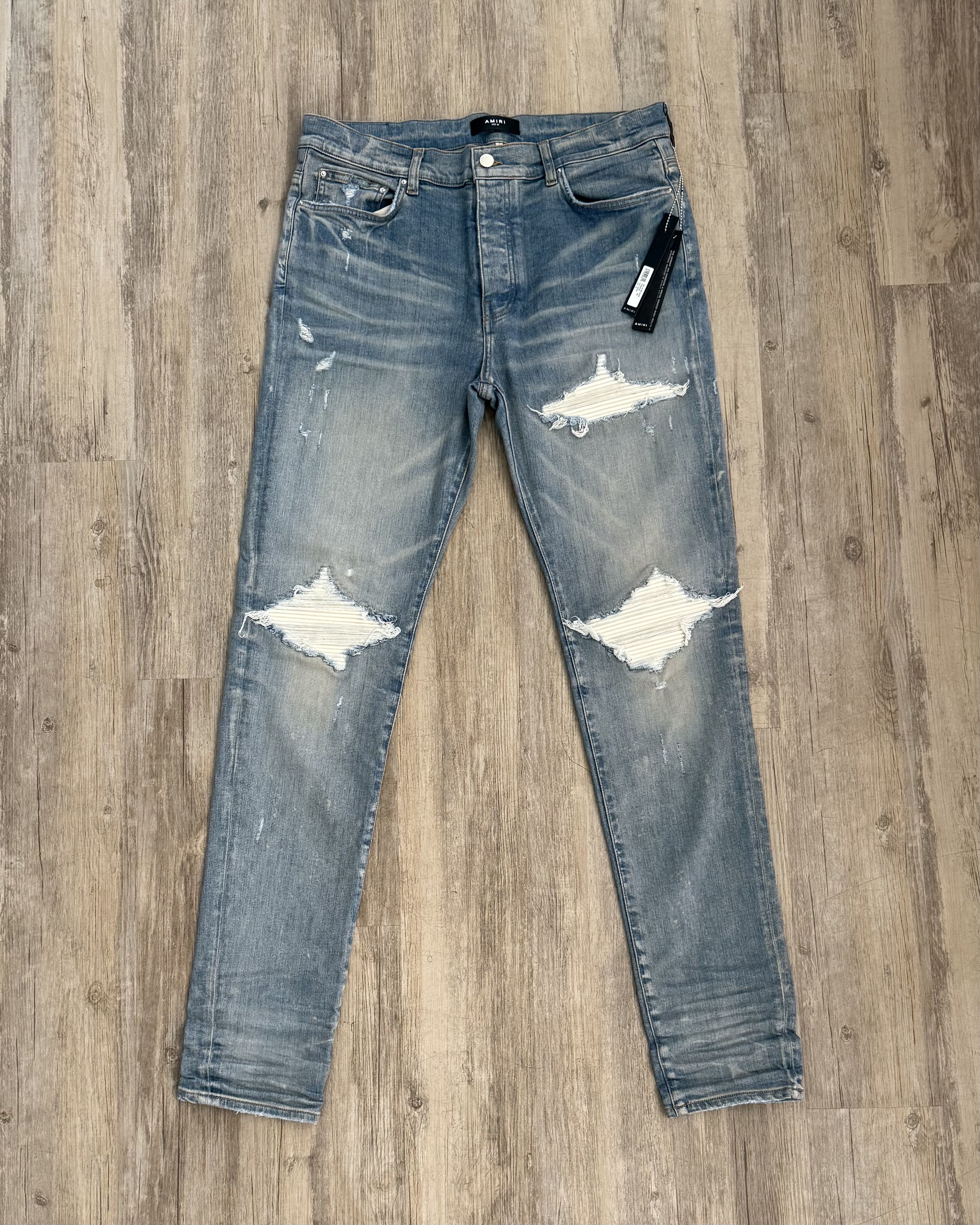 Amiri Amiri MX1 White Patch Jeans | Grailed