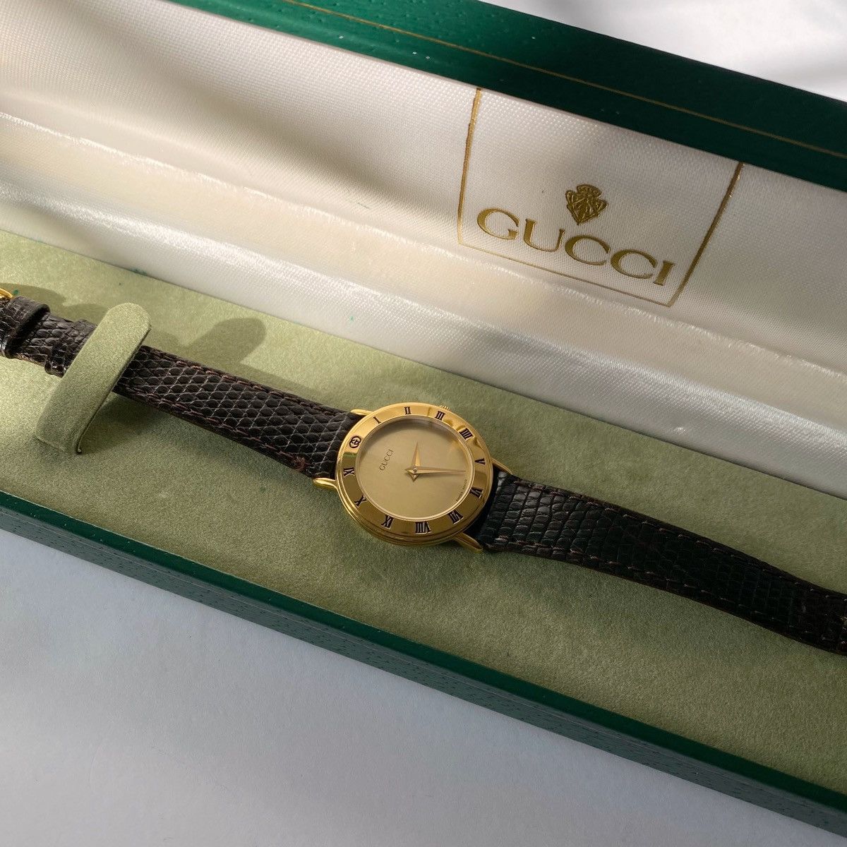 Gucci × Vintage Gucci 90s Gold Plated Leather Round Watch | Grailed