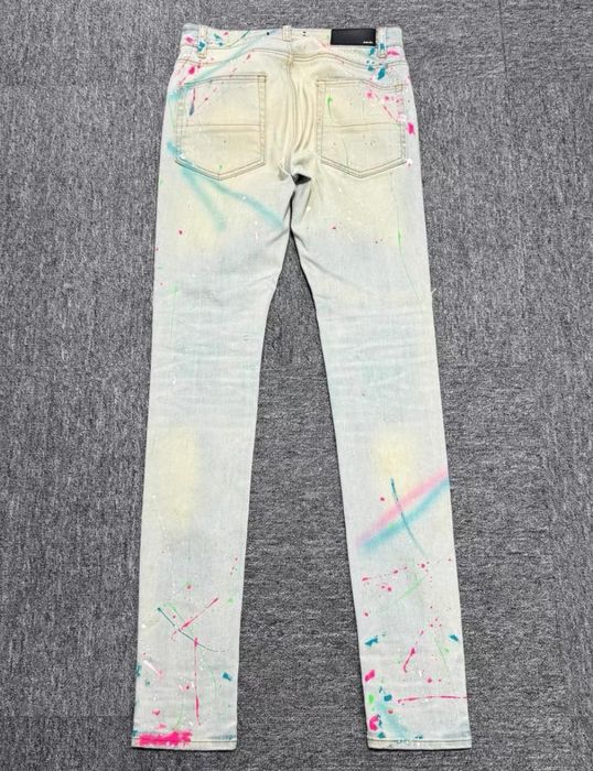Amiri Amiri blue splash-ink jeans with holes | Grailed
