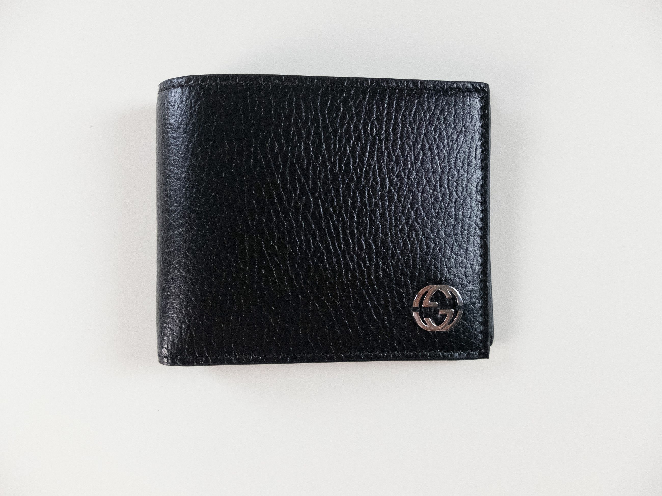 Gucci GUCCI full black interlocking GG logo bifold leather wallet | Grailed