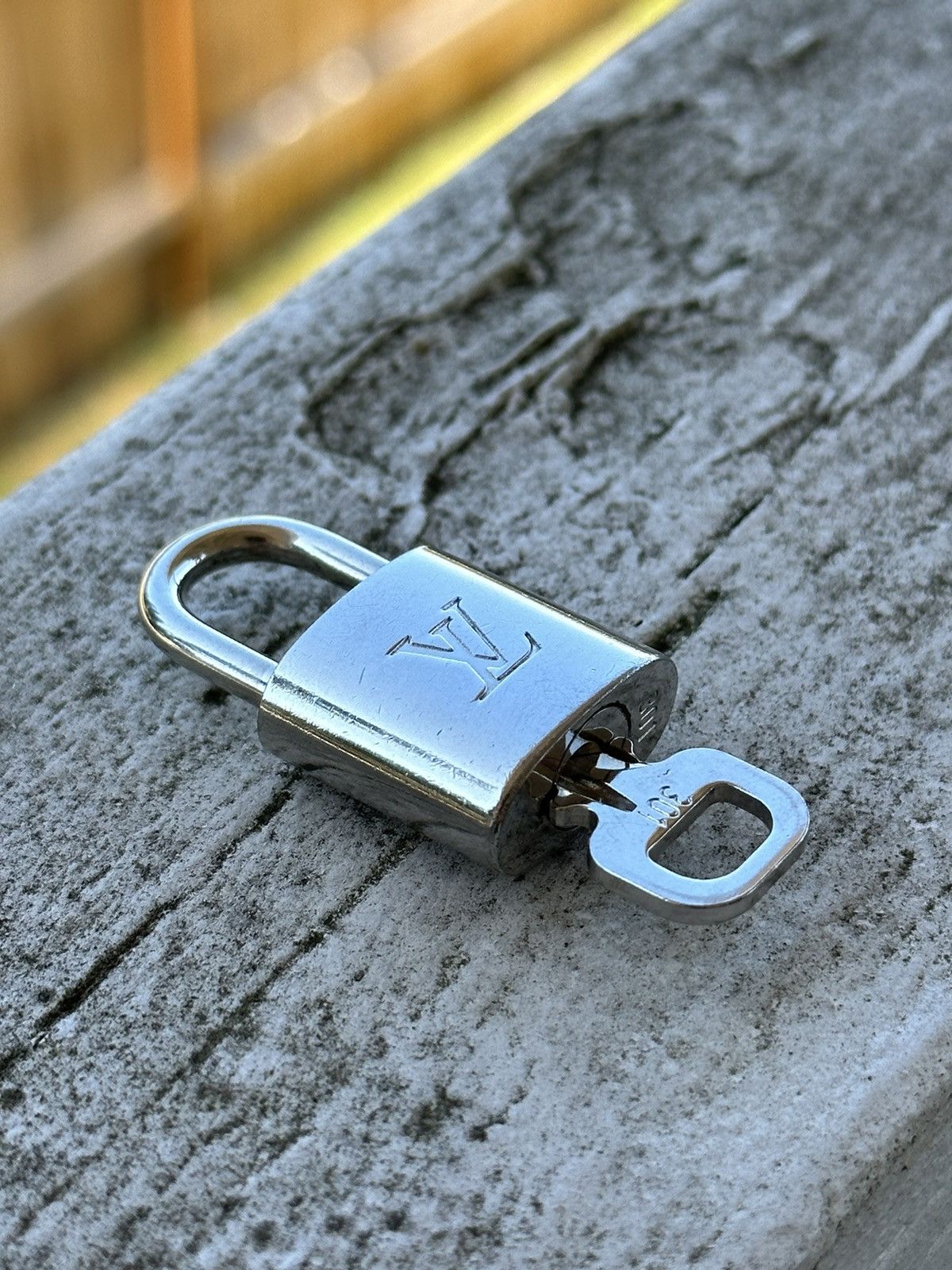 Louis Vuitton Louis Vuitton LV Lock | Grailed