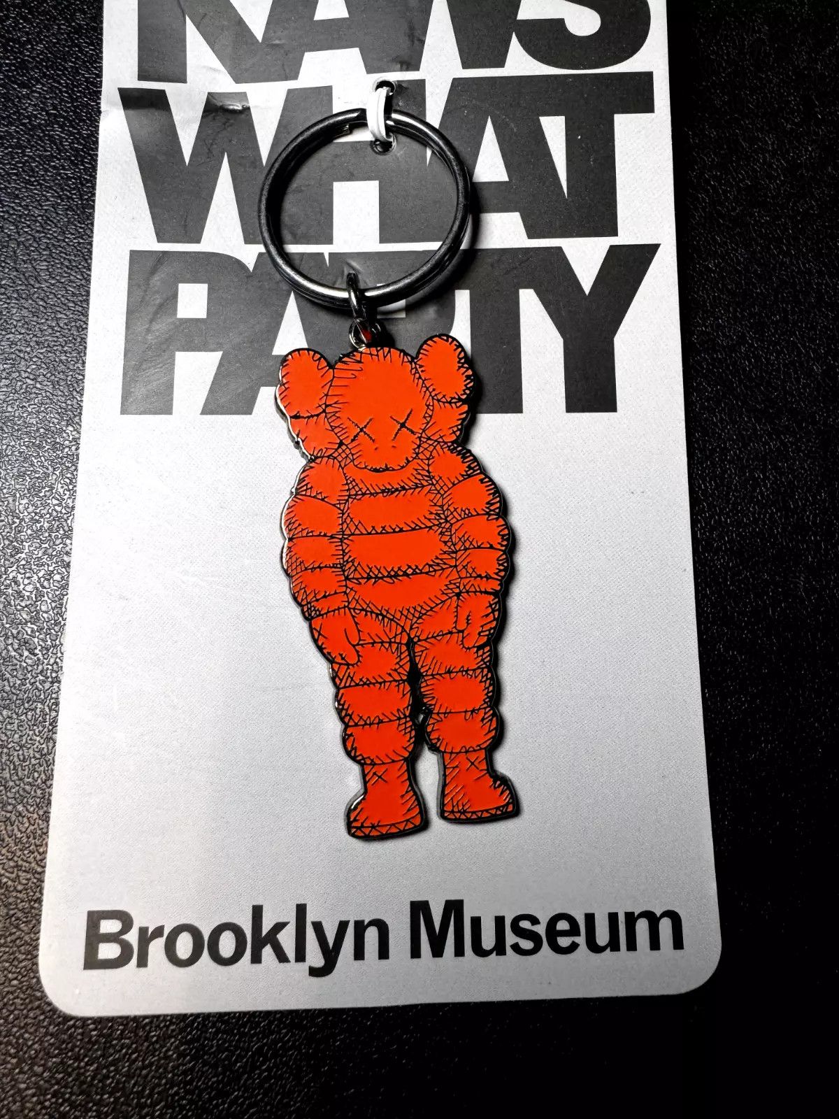 Kaws KAWS x BROOKLYN MUSEUM WHAT PARTY KEY CHAIN ORANGE | Grailed