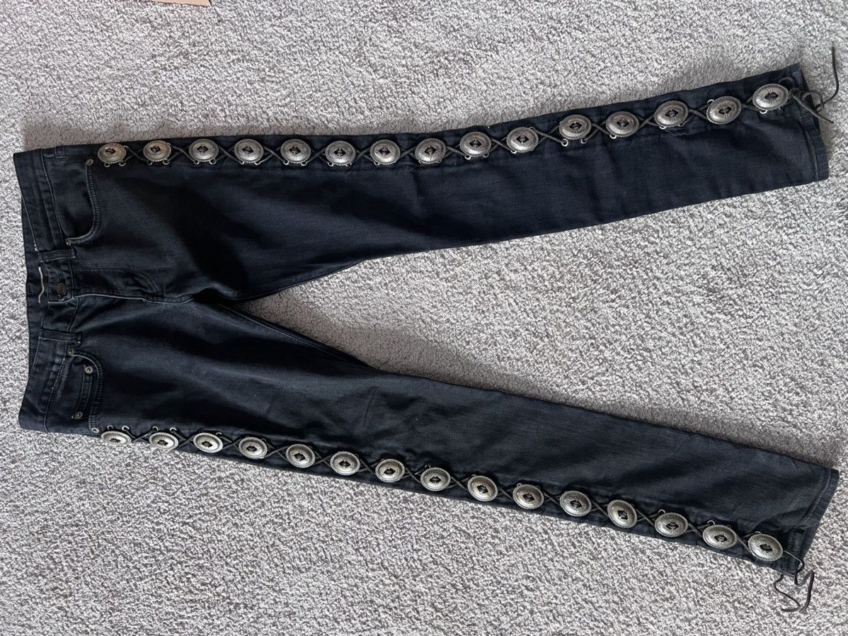 Saint Laurent Paris Saint Laurent Concho D02 denim medallion jeans ...