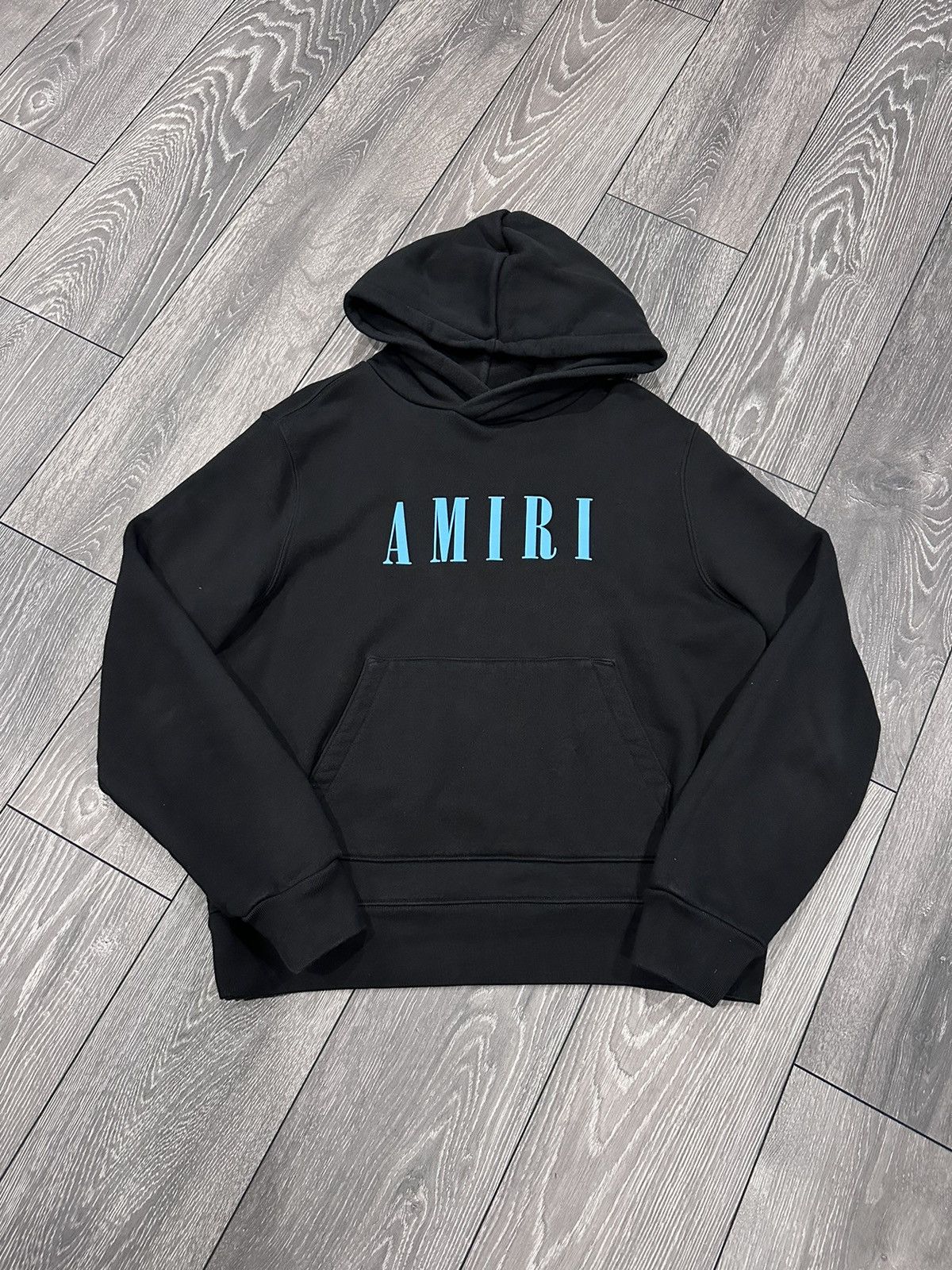 Amiri amiri core logo baby blue on black boxy hoodie | Grailed