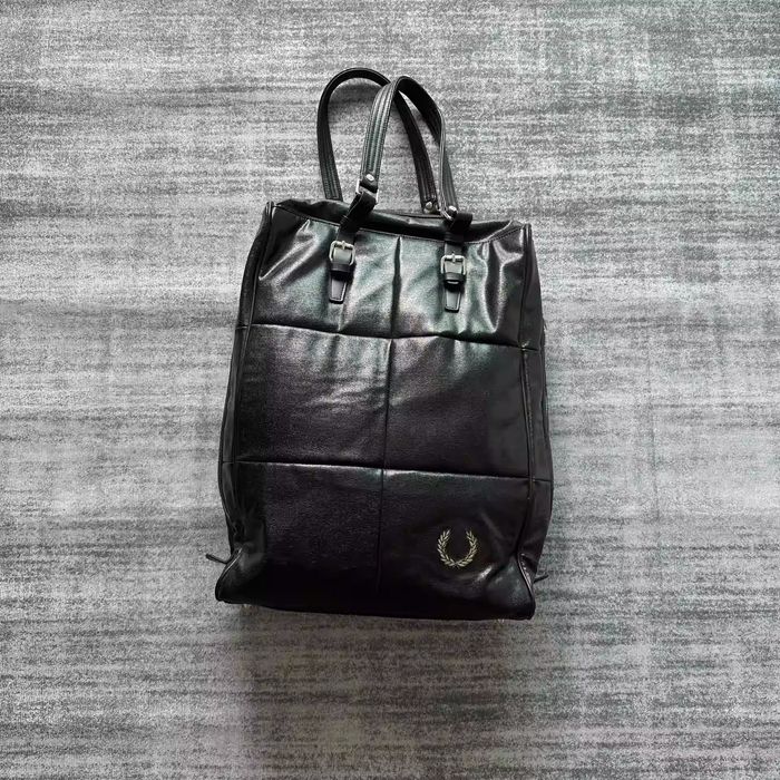 Raf Simons raf simons fred perry co-branded leather travel bag | Grailed