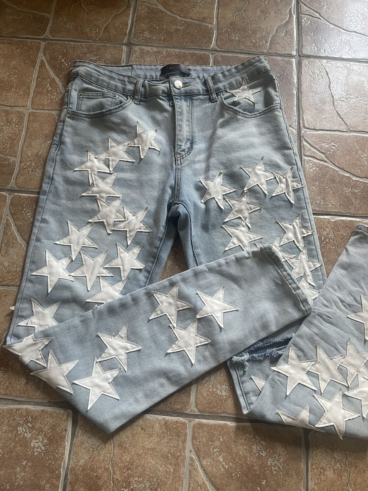 Amiri Light blue Amiri Star patch jeans | Grailed