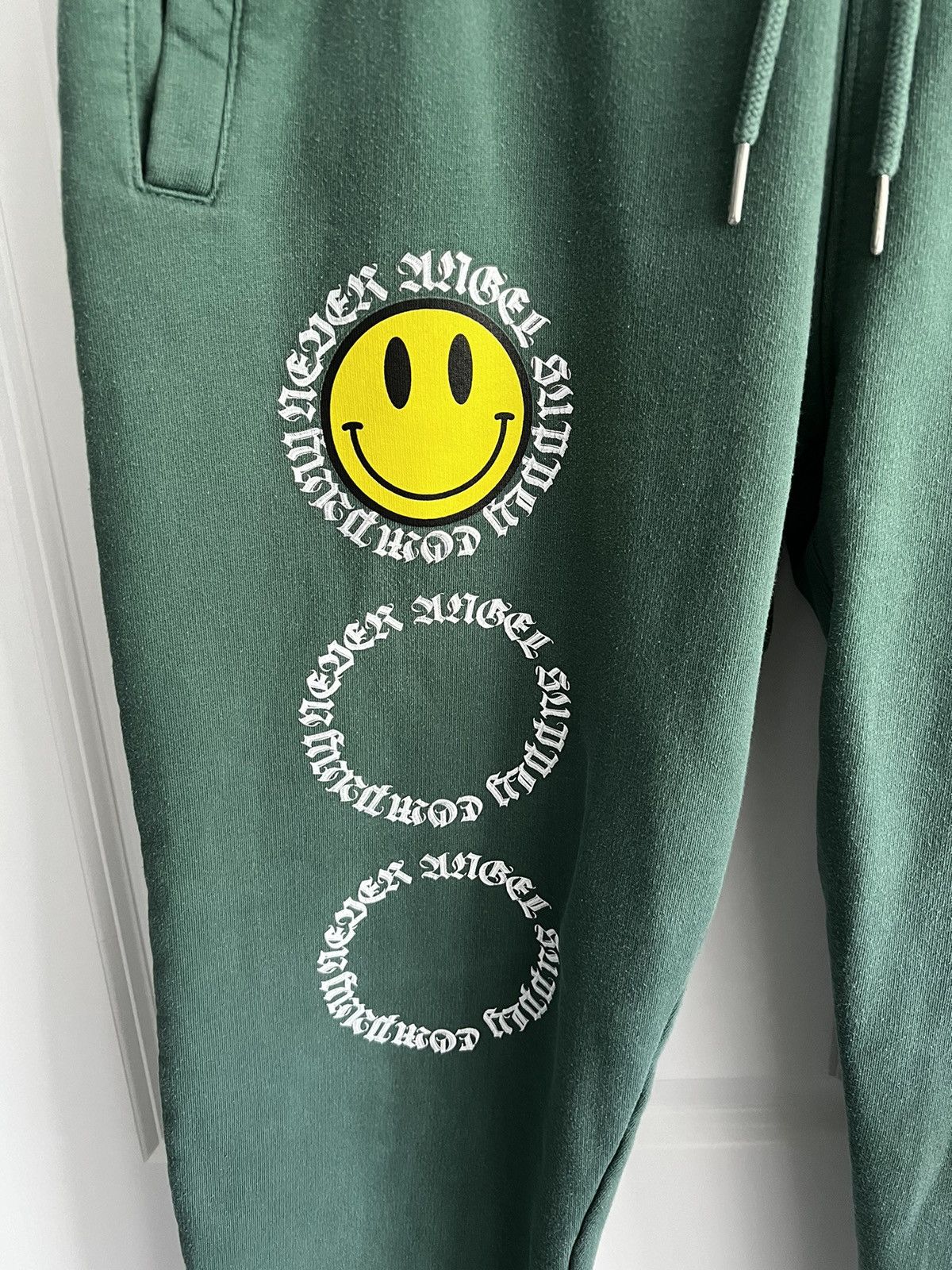 Streetwear × The GV Gallery Never Angel Smiley Face Sweatpants | Grailed