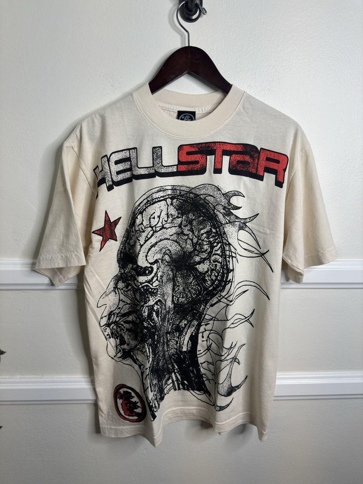 HELLSTAR Hellstar Studios Human Development Tee Cream | Grailed