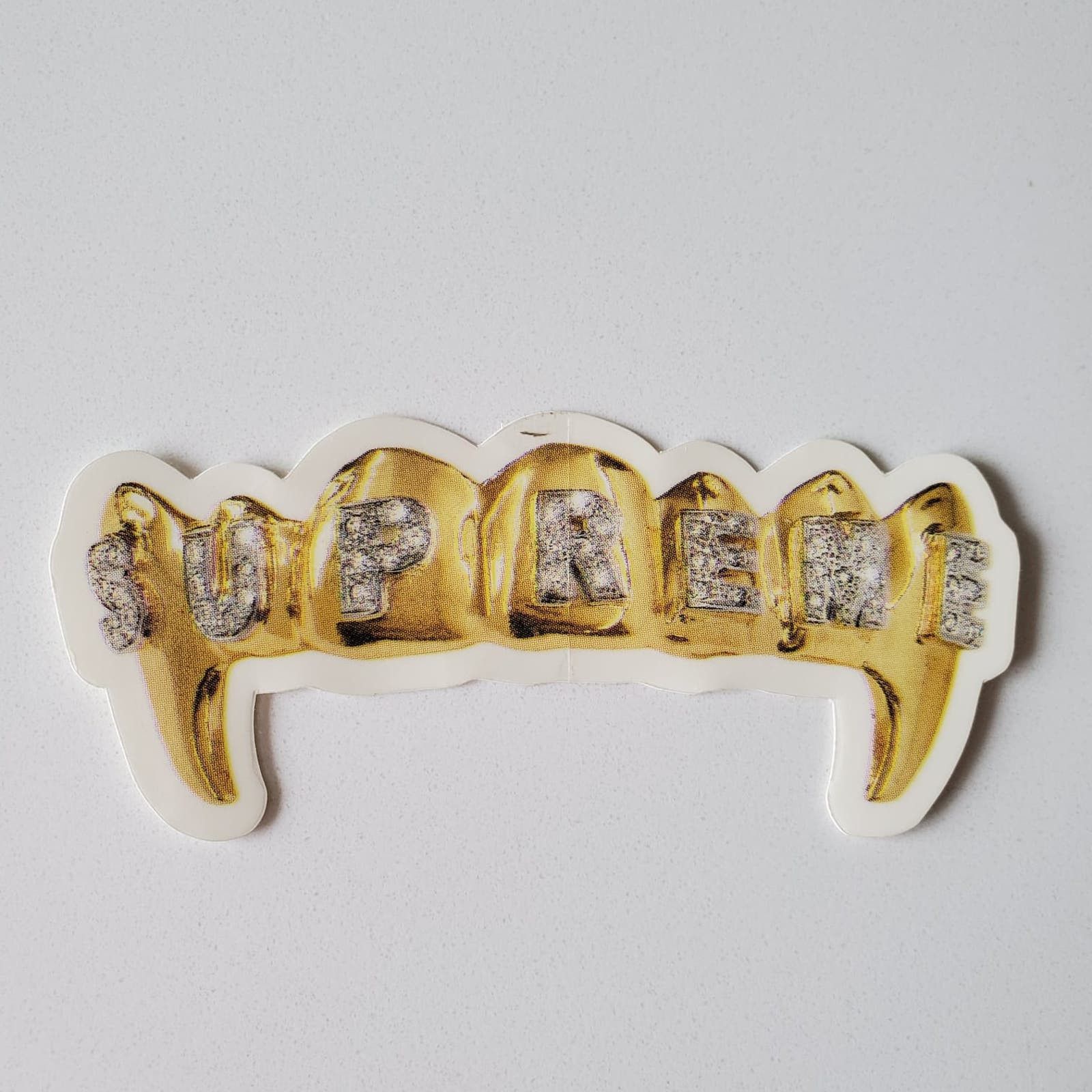 Supreme SUPREME Gold Fronts Grills Teeth Sticker Brick Logo, 3.5in ...