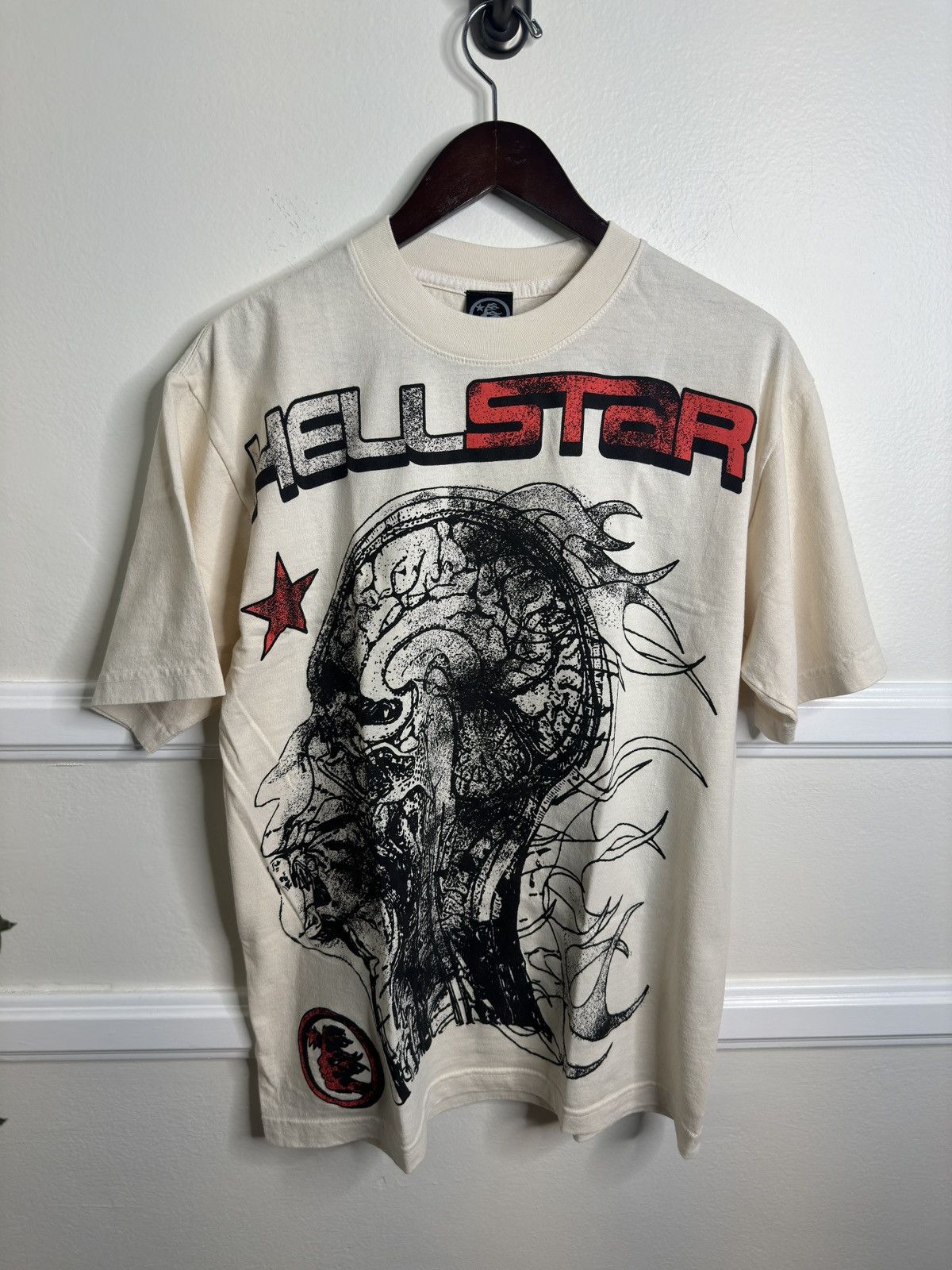 HELLSTAR Hellstar Studios Human Development Tee Cream | Grailed