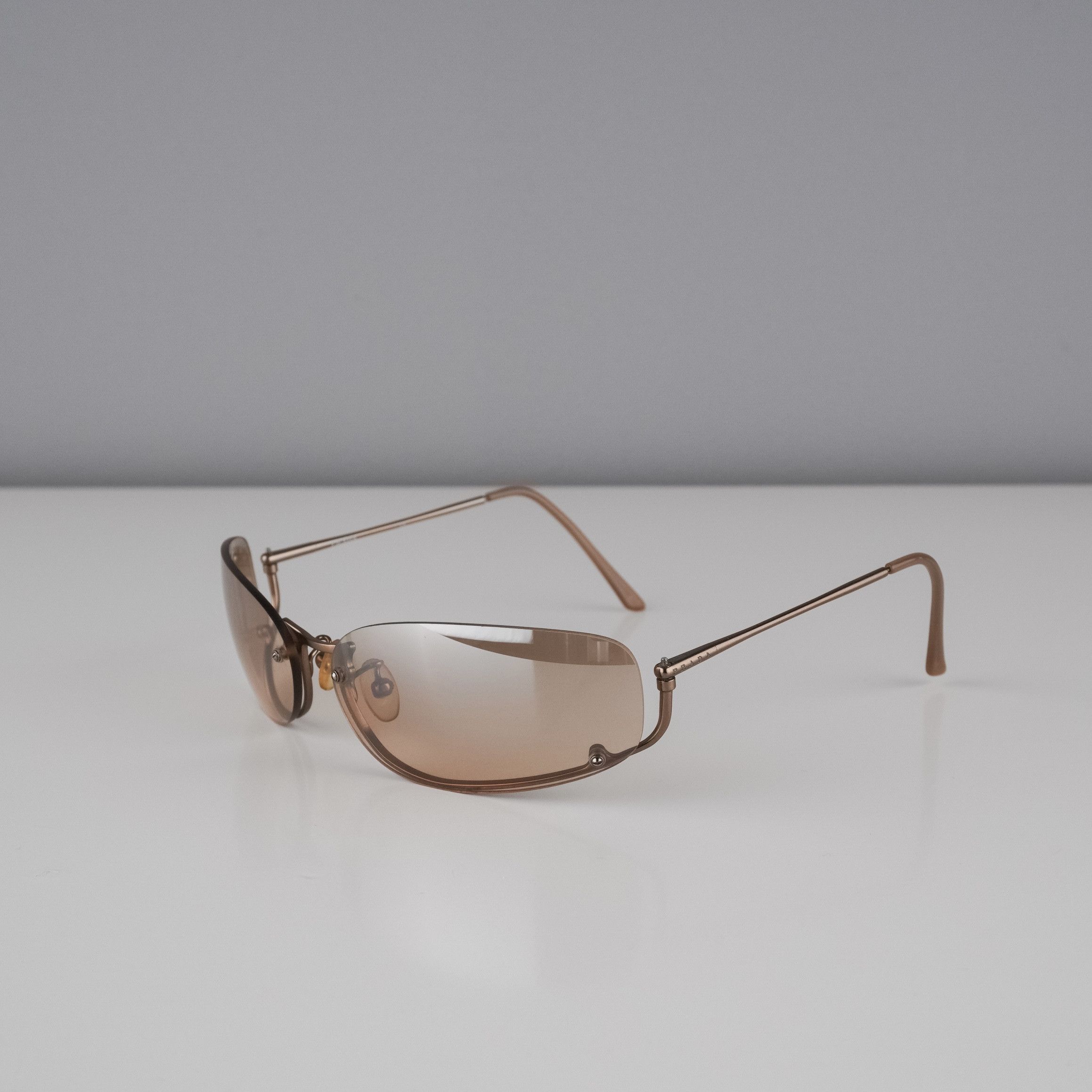 Prada Prada gold gradient lenses rimless sunglasses | Grailed