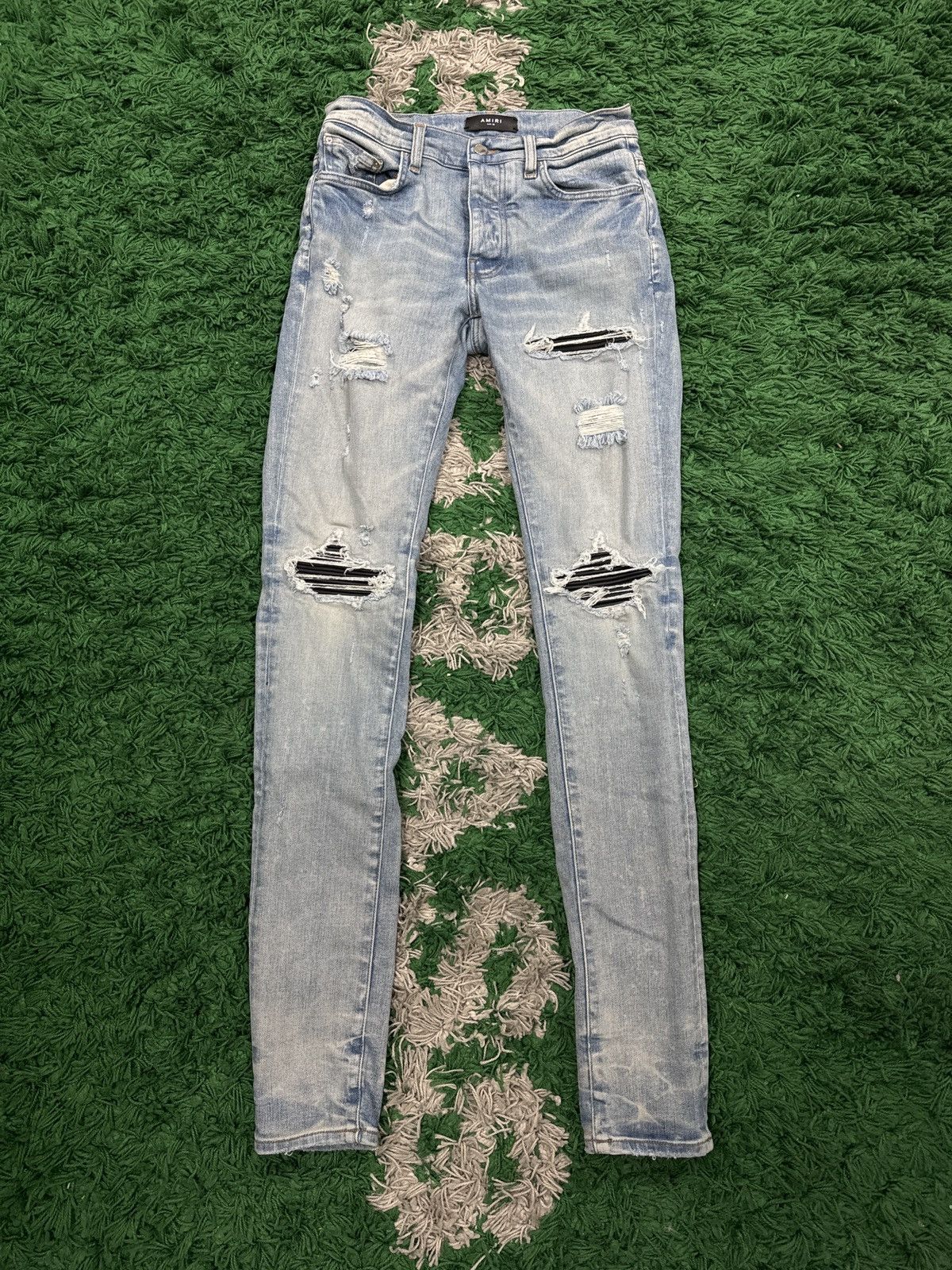 Amiri Amiri light wash black patch | Grailed