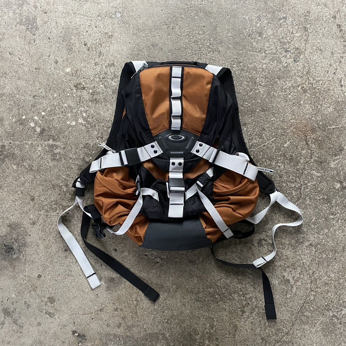 Oakley early 2000s oakley black orange rare multipocket backpack | Grailed
