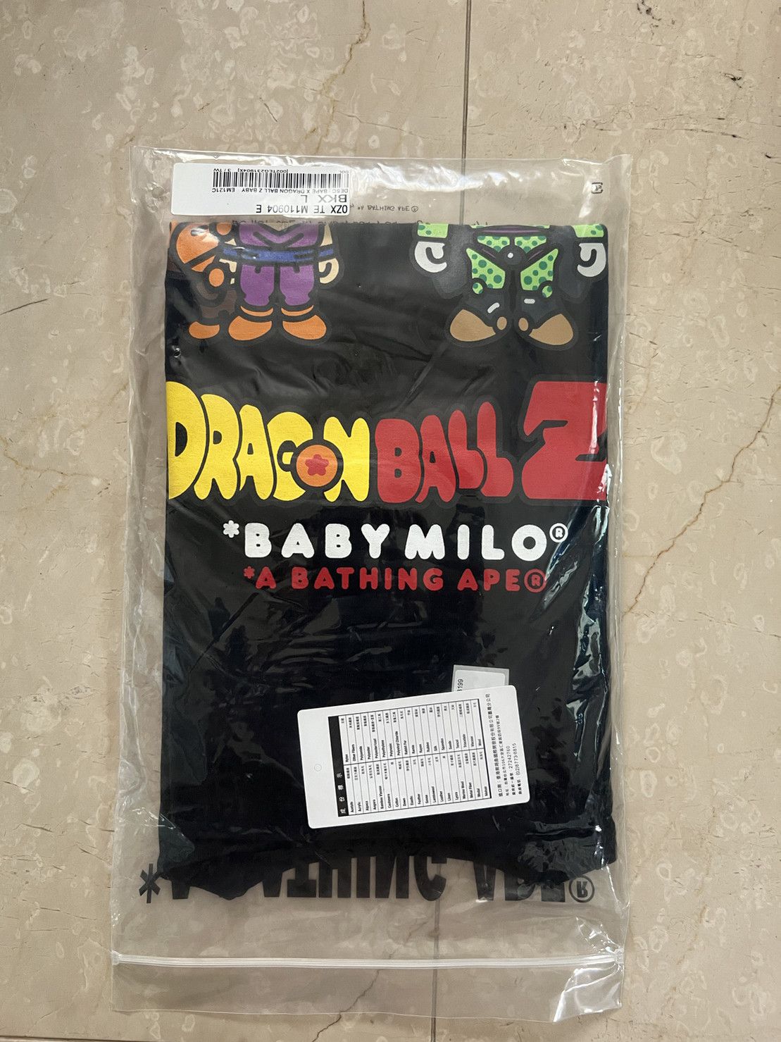 Bape BAPE x Dragon Ball Z Baby Milo Son Gohan & Cell Tee Black | Grailed