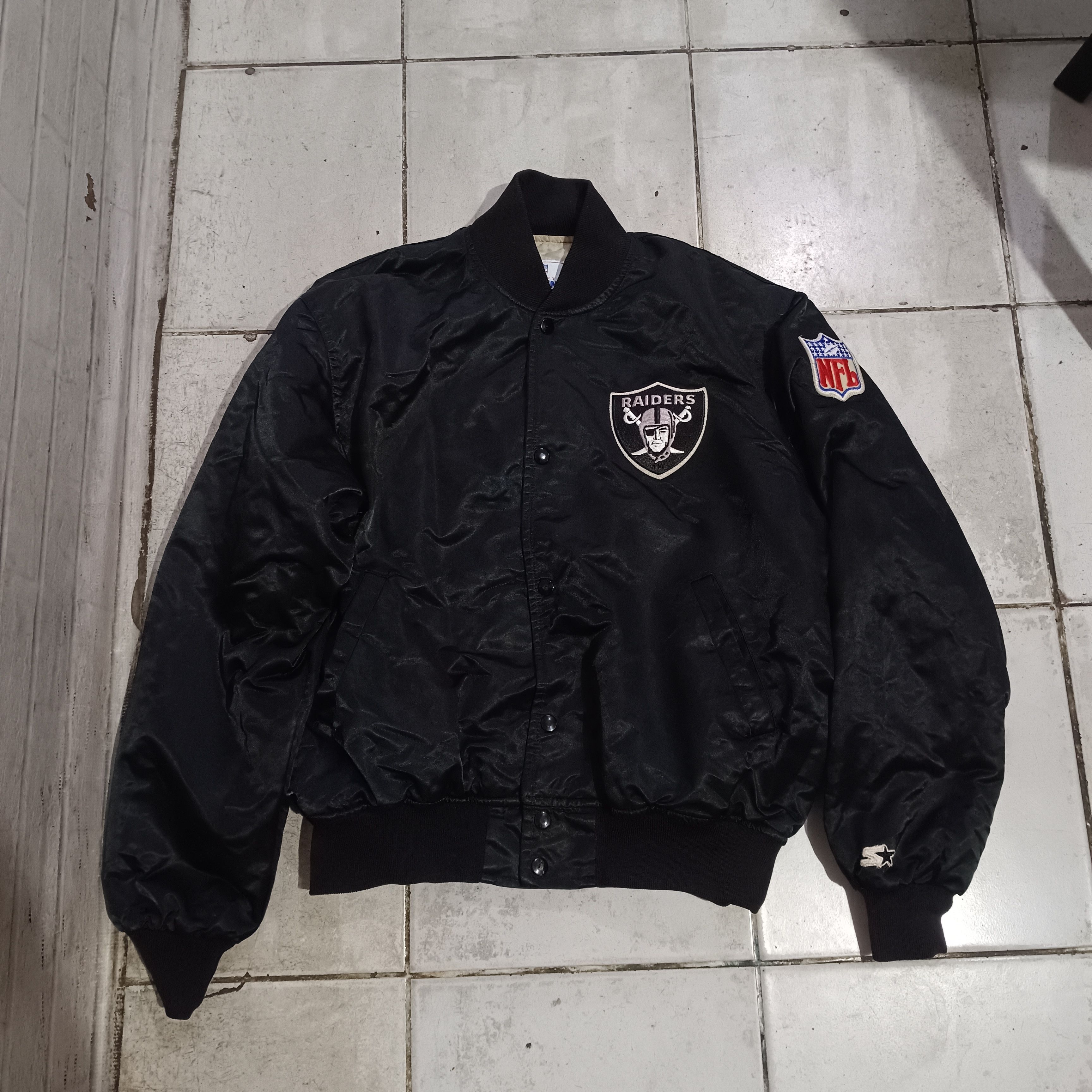Starter Raiders varsity black | Grailed