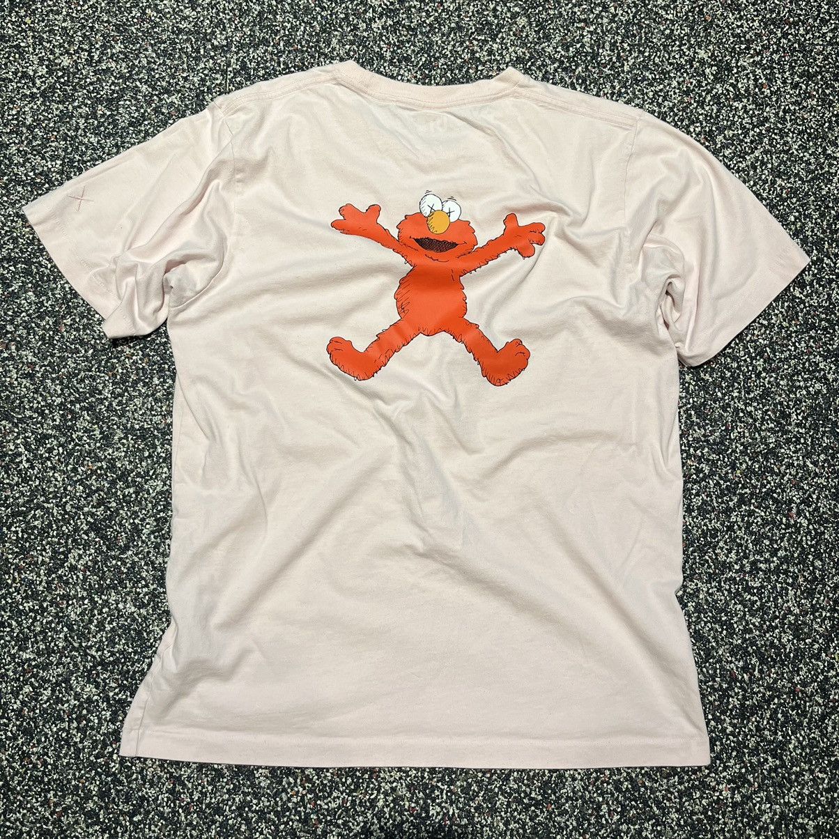 Kaws Kaws Sesame Street Light Pink Elmo T-Shirt | Grailed